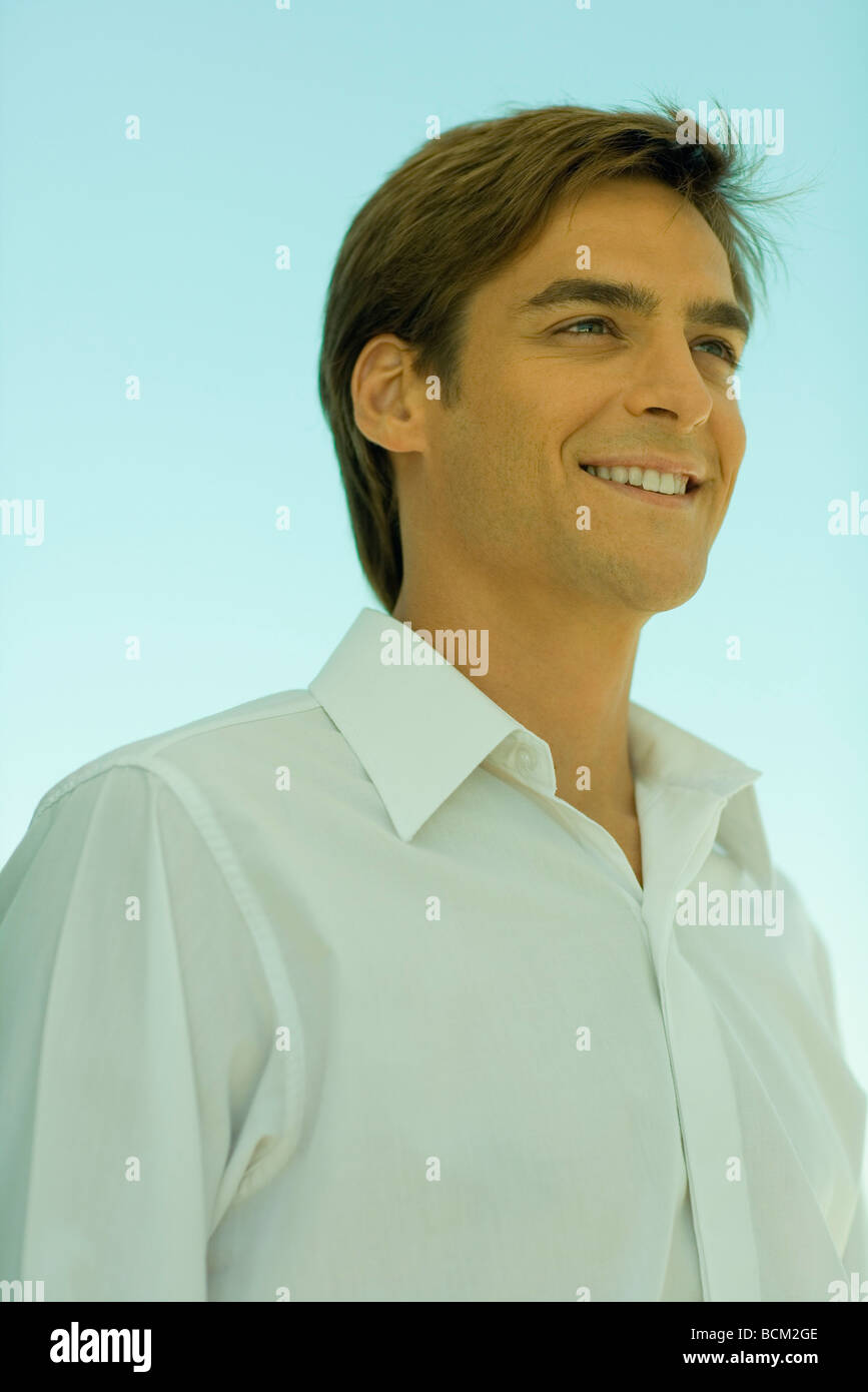 Man smiling, looking away, portrait Stock Photo - Alamy