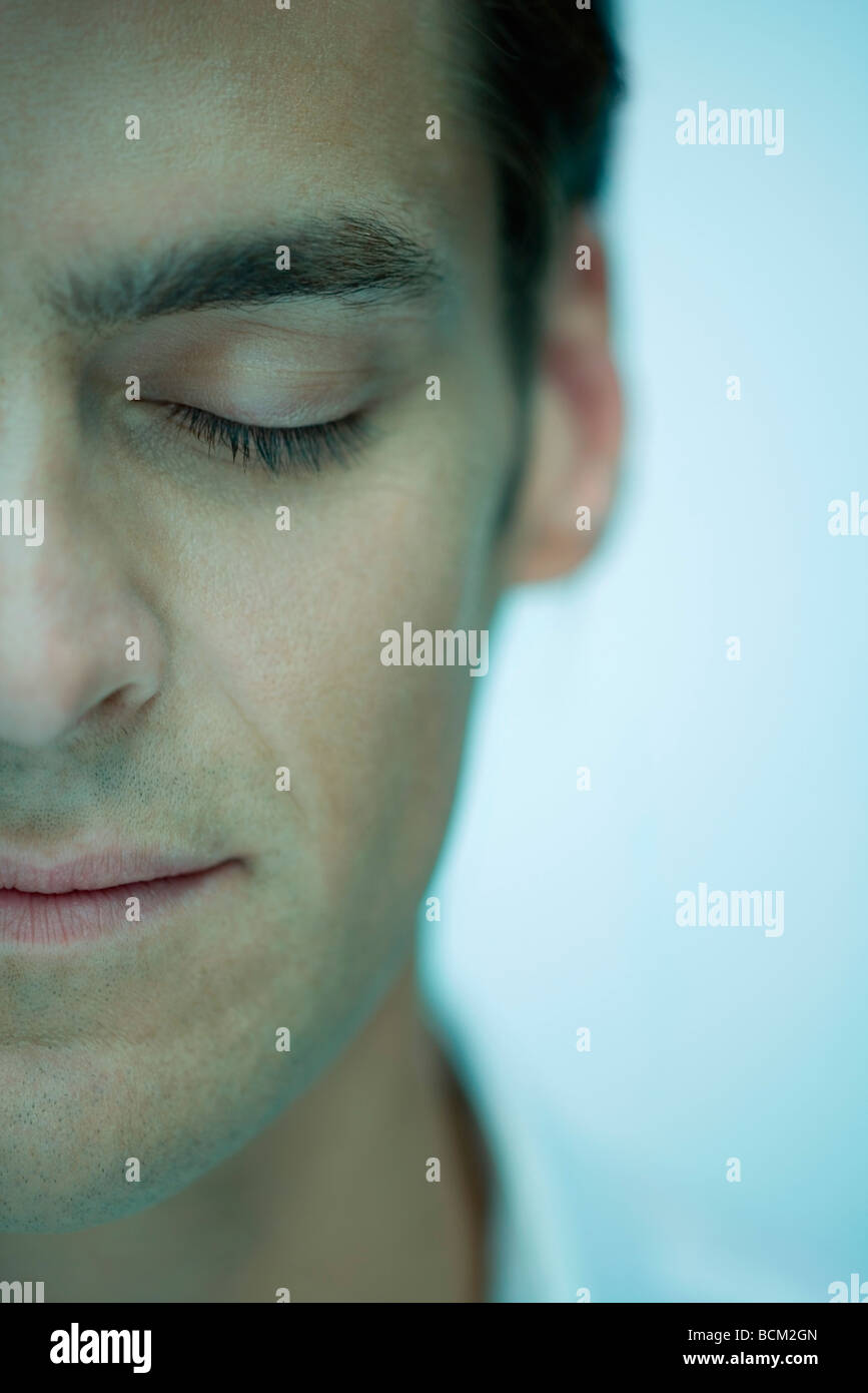 Man with eyes closed, cropped Stock Photo - Alamy