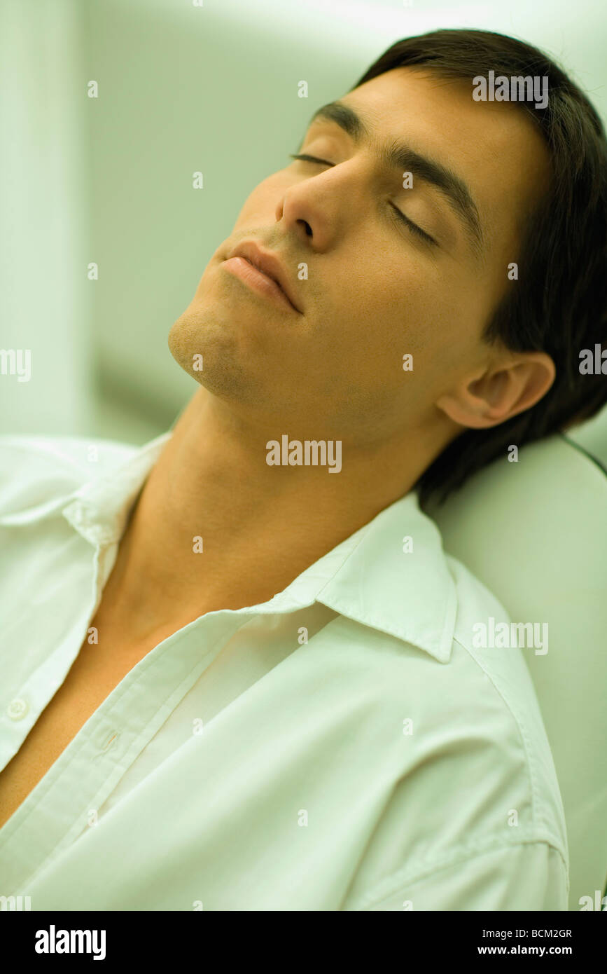 Man leaning back with eyes closed, close-up Stock Photo - Alamy
