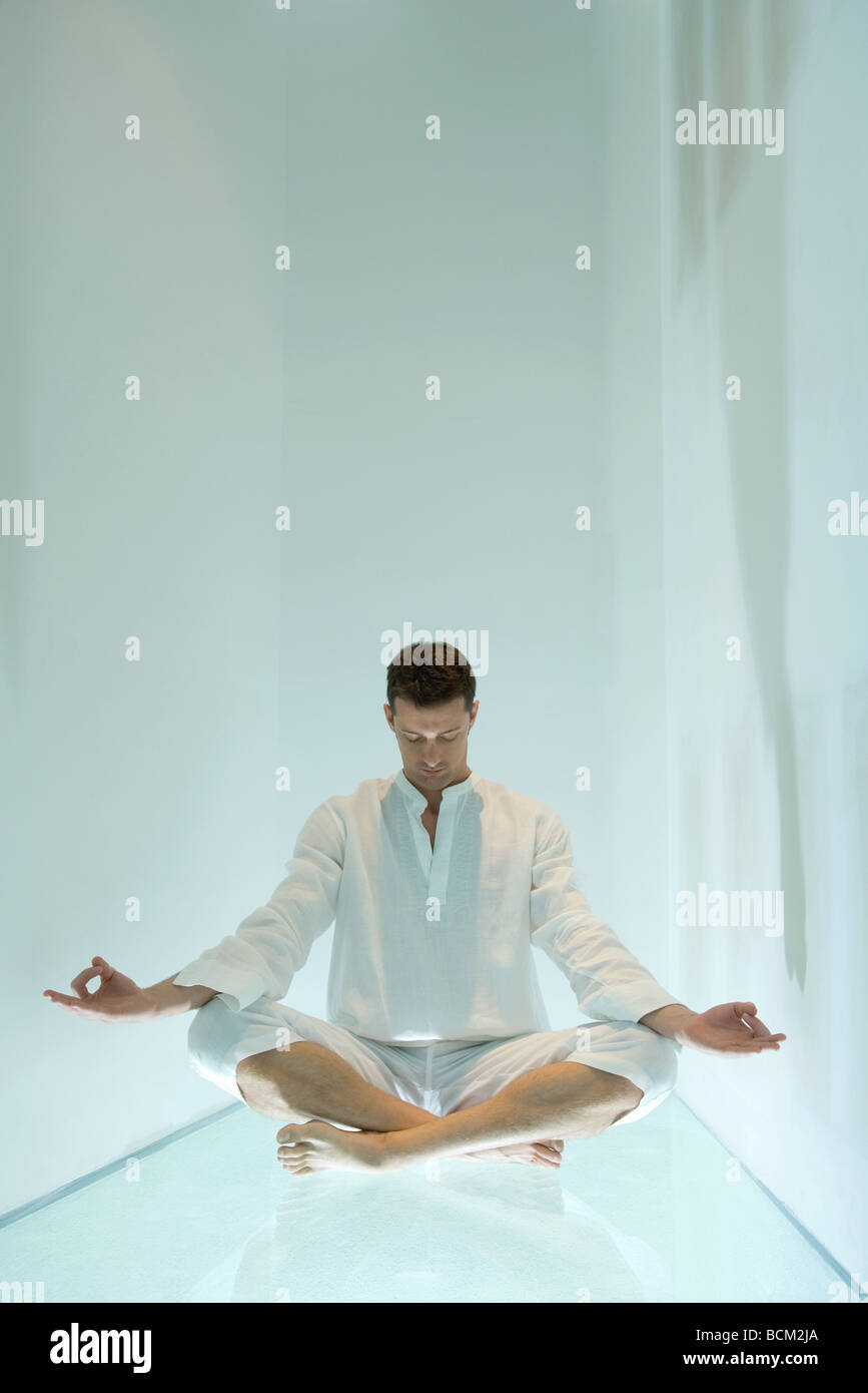 Man meditating in lotus position Stock Photo - Alamy