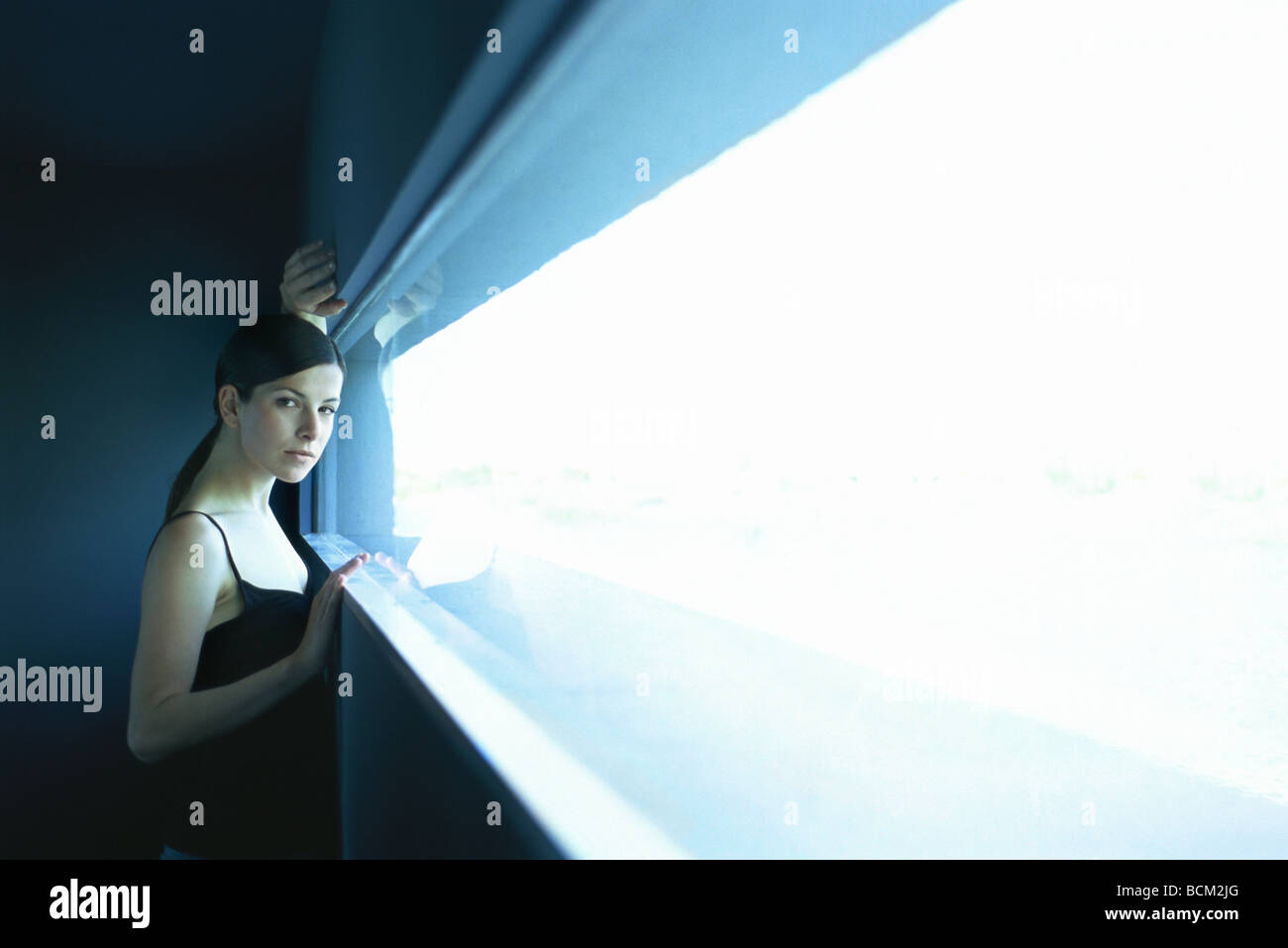 Back view young woman looking distance hi-res stock photography and ...