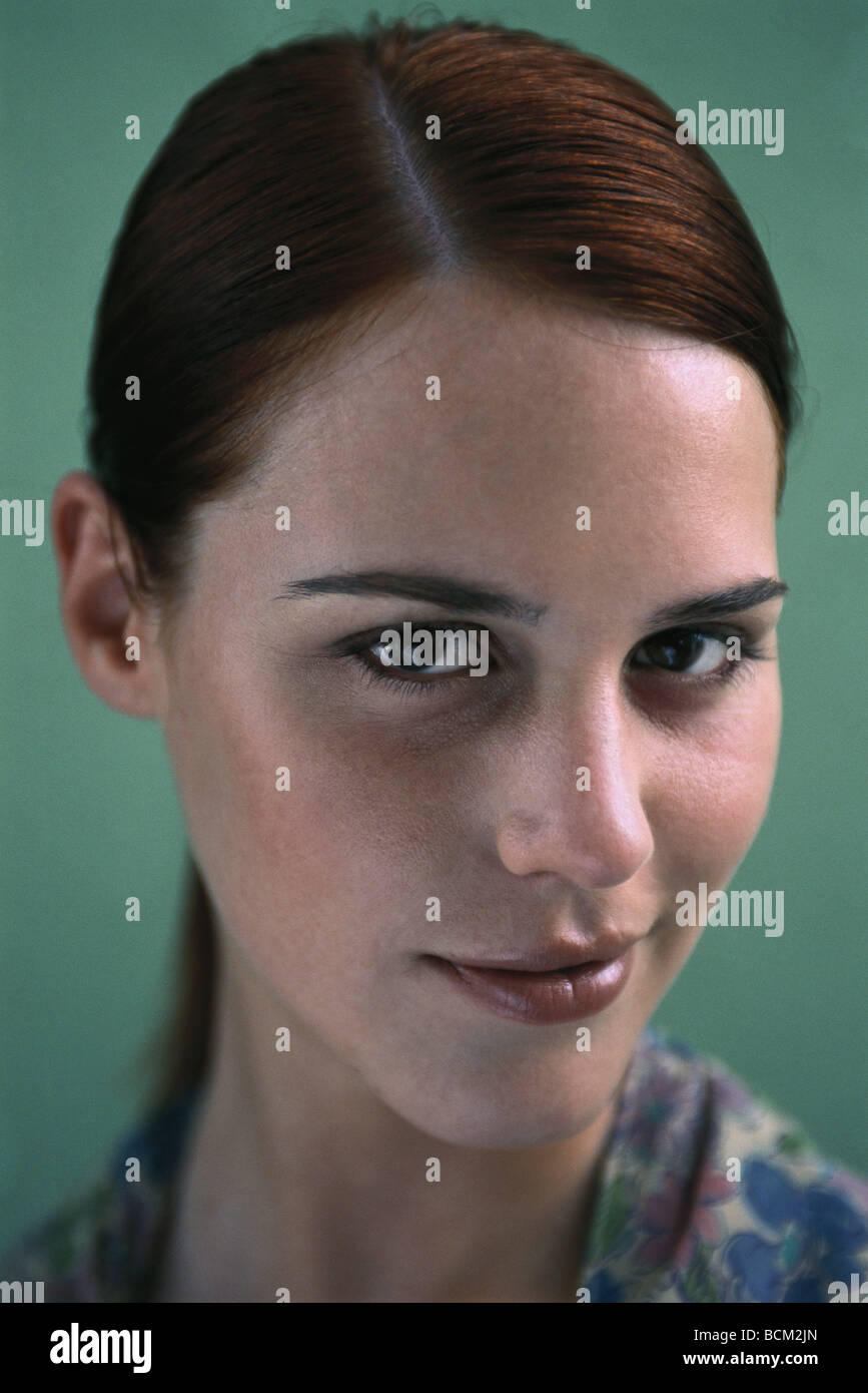 Young woman smirking at camera, portrait Stock Photo - Alamy Young woman smirking at camera, portrait Stock Photo - Alamy