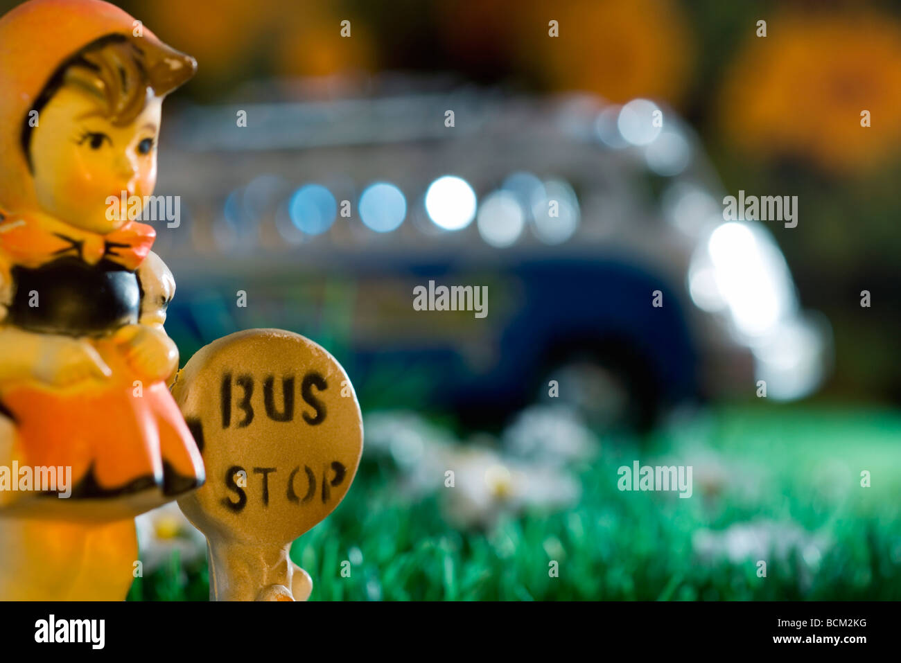 Figurine waiting at bus stop Stock Photo - Alamy