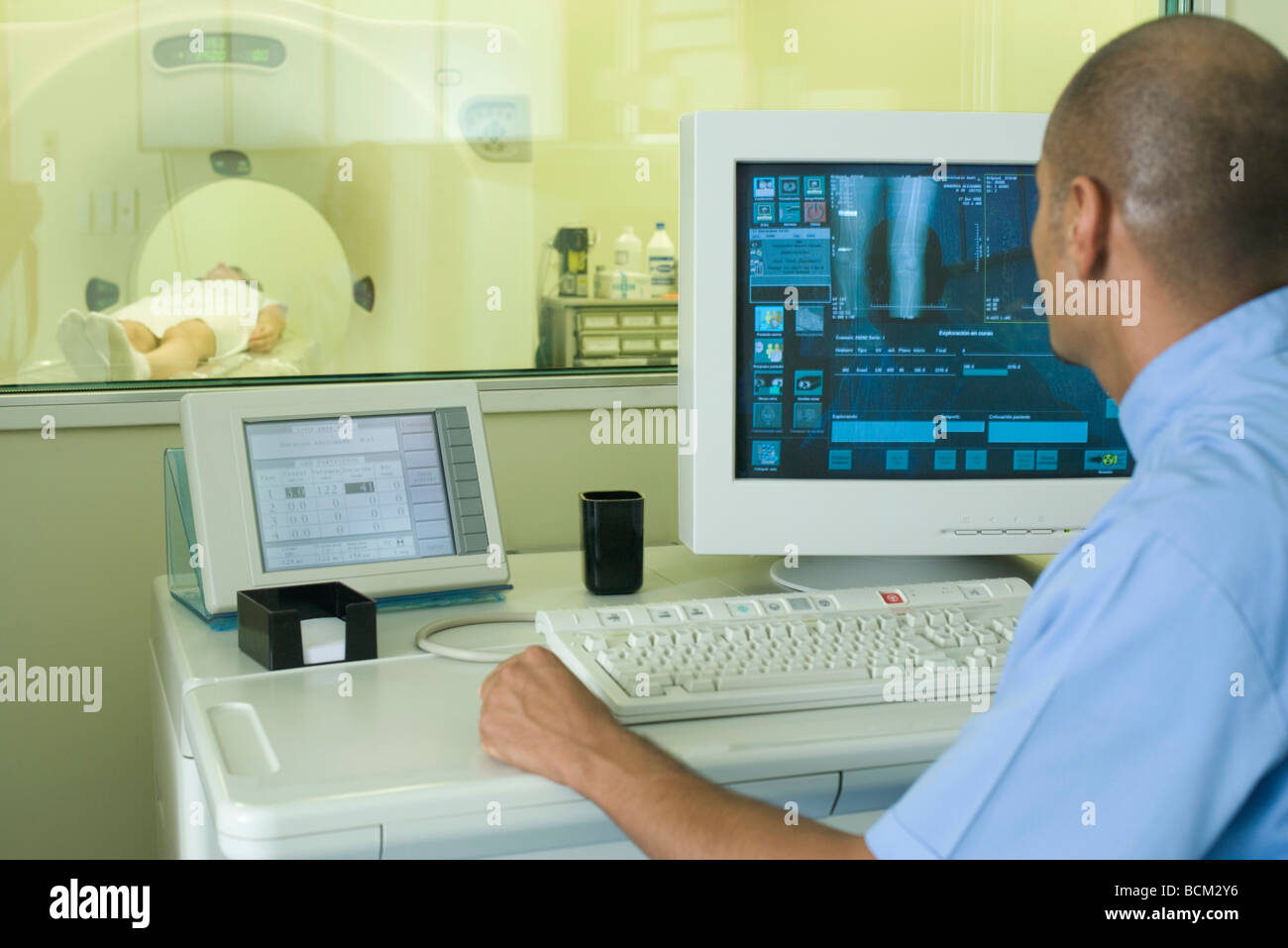 Radiologist monitoring patient undergoing MRI Stock Photo - Alamy