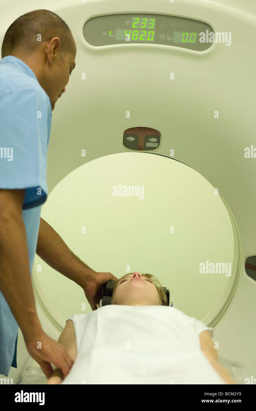 Radiologist preparing female patient for MRI Stock Photo - Alamy