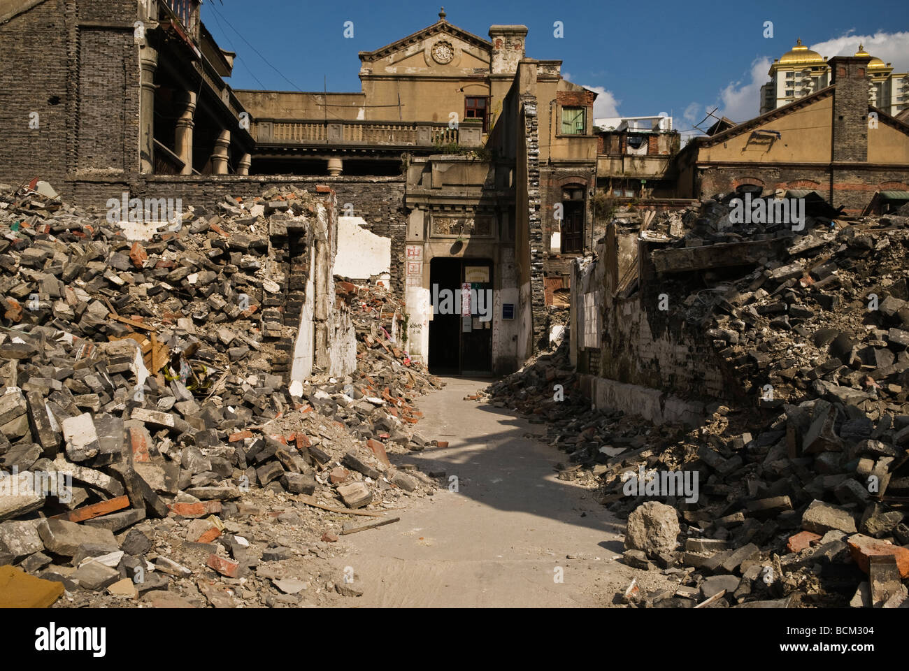 Building surrounded by rubble from demolished buildings, Shanghai ...
