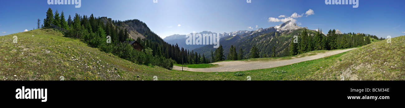 Mountain landscape, house visible in distance Stock Photo - Alamy