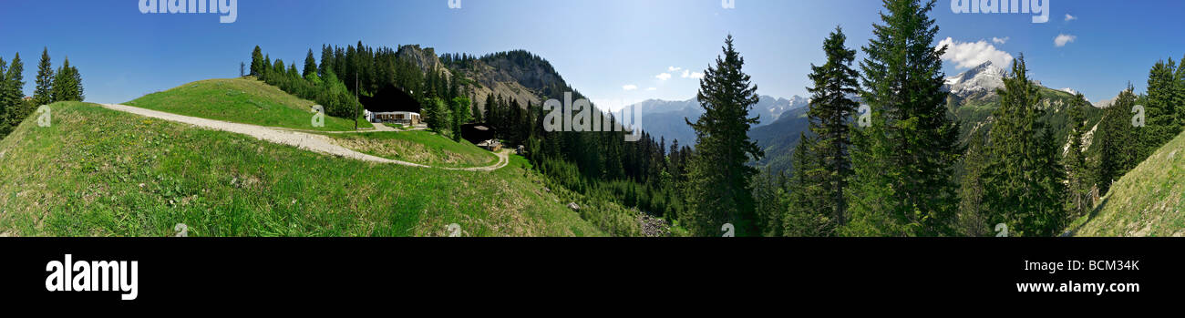 Mountain landscape, houses visible in distance Stock Photo - Alamy