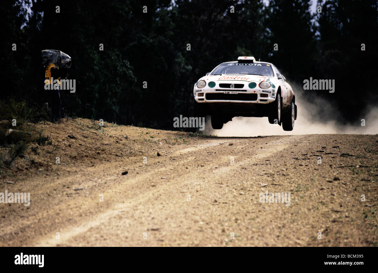 Television Cameraman Records a Toyota Rally Car Airborne Above Dirt ...