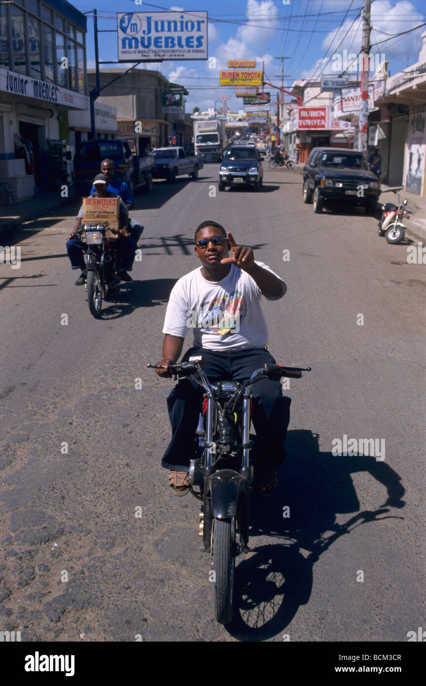 Happy motorcyclist in town street. Higuey, Dominican Republic Island ...