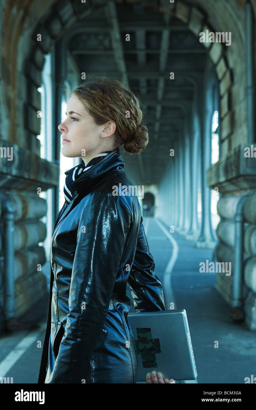 Carrying laptop under arm hi-res stock photography and images - Alamy