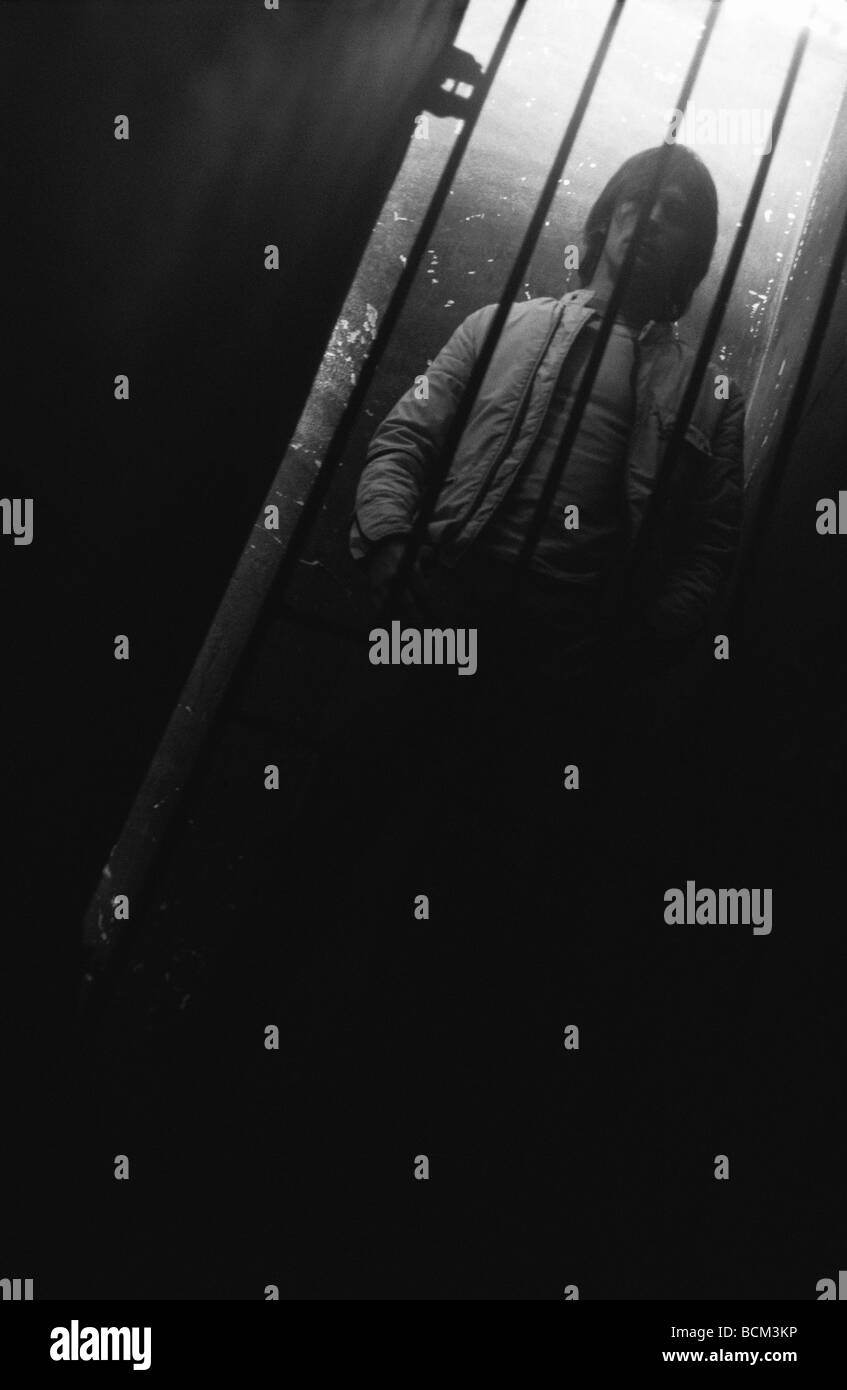 Jail bars on white Black and White Stock Photos & Images - Alamy