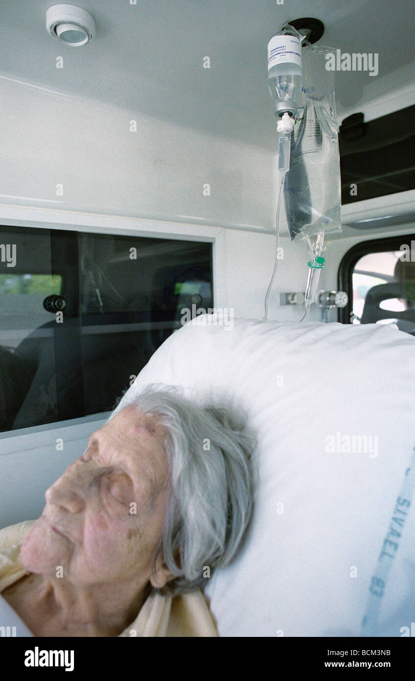 Elderly woman in ambulance Stock Photo - Alamy
