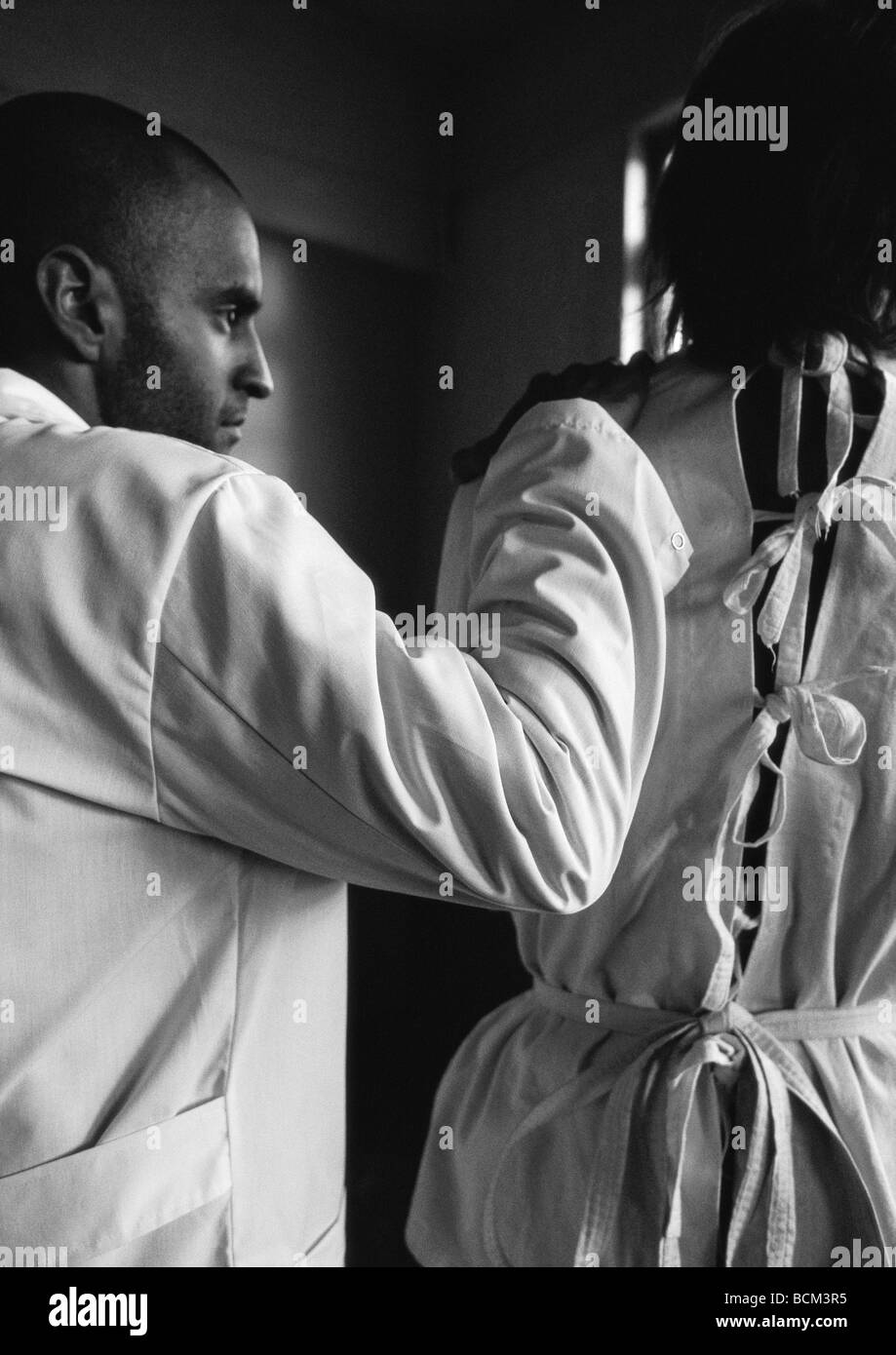 Man dark hair doctor patient Black and White Stock Photos & Images - Alamy