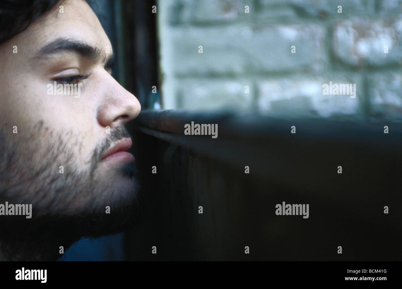 Man peeking over wall hi-res stock photography and images - Alamy