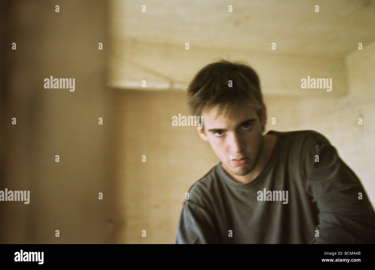 Young man staring at camera Stock Photo - Alamy