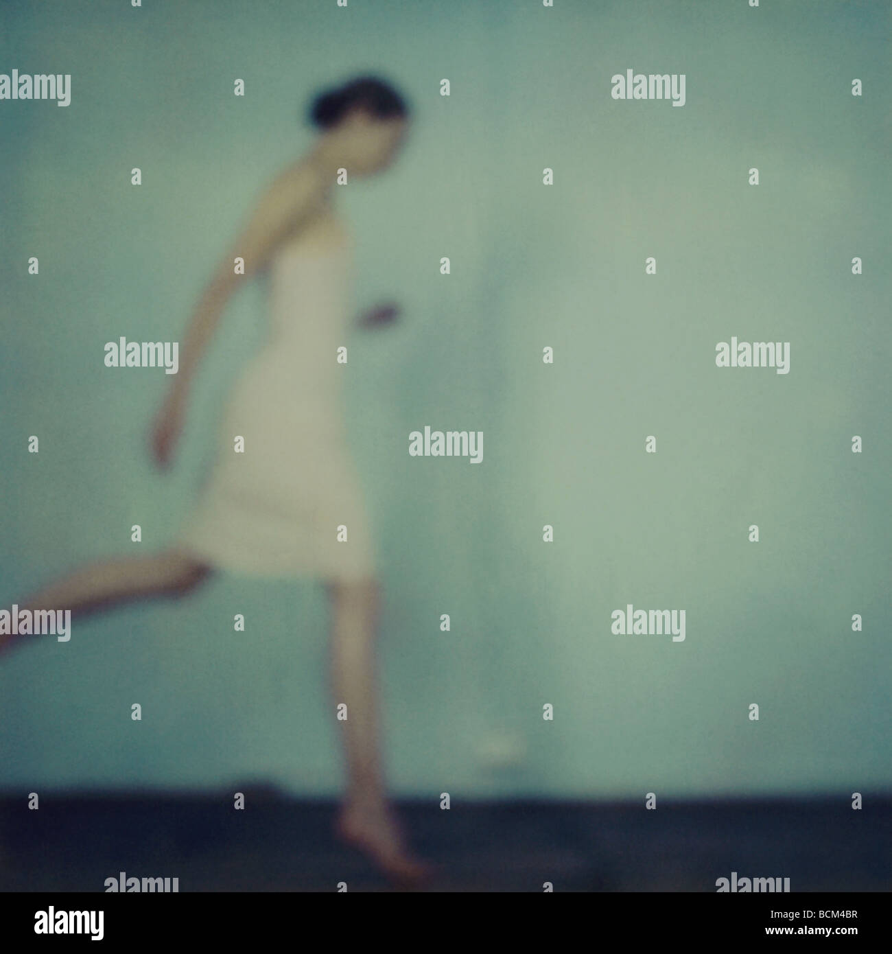 Young woman leaping, side view Stock Photo - Alamy