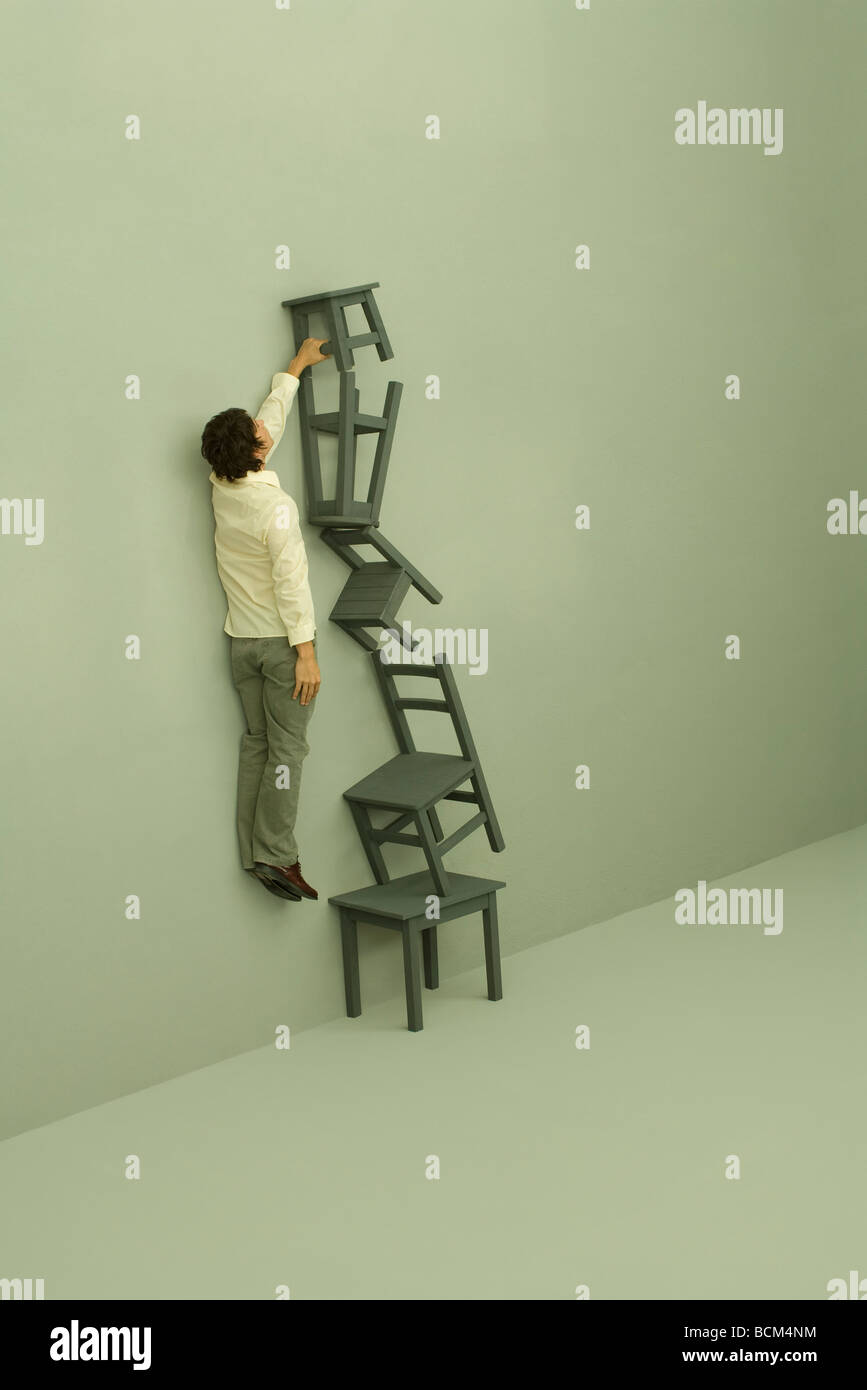 Precariously holds hi-res stock photography and images - Alamy