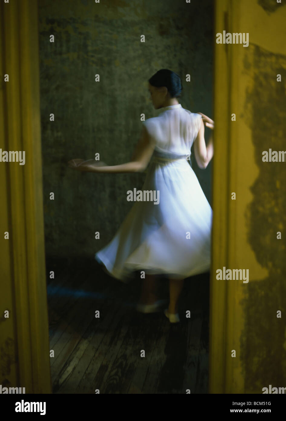Woman dancing, rear view through doorway Stock Photo - Alamy