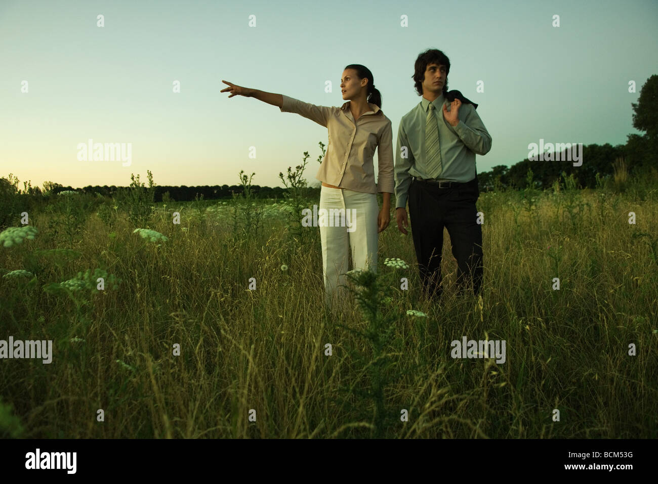 Couple couples distance grass hi-res stock photography and images - Alamy