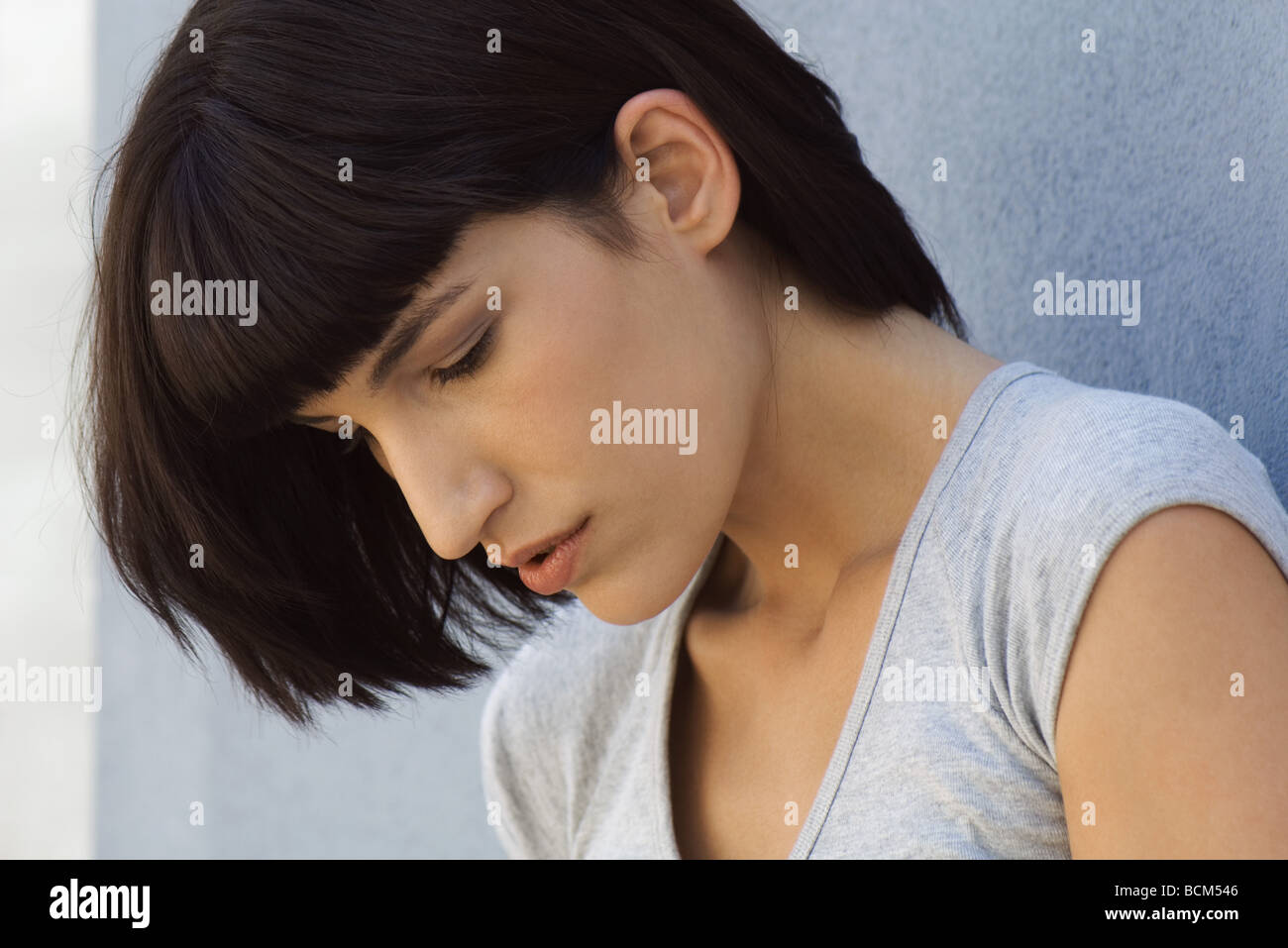 Woman with head down, portrait Stock Photo - Alamy
