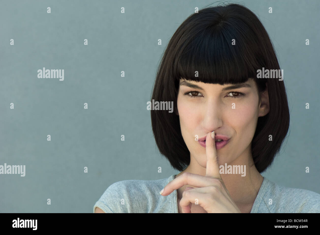 Women Touching Finger To Lips High Resolution Stock Photography and ...