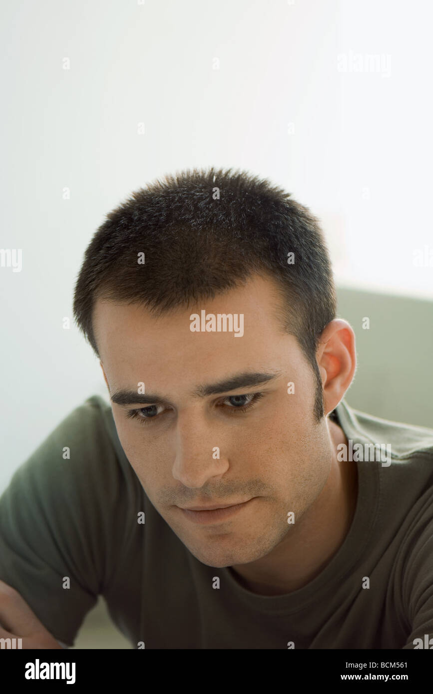 Man looking down, smiling, portrait Stock Photo - Alamy