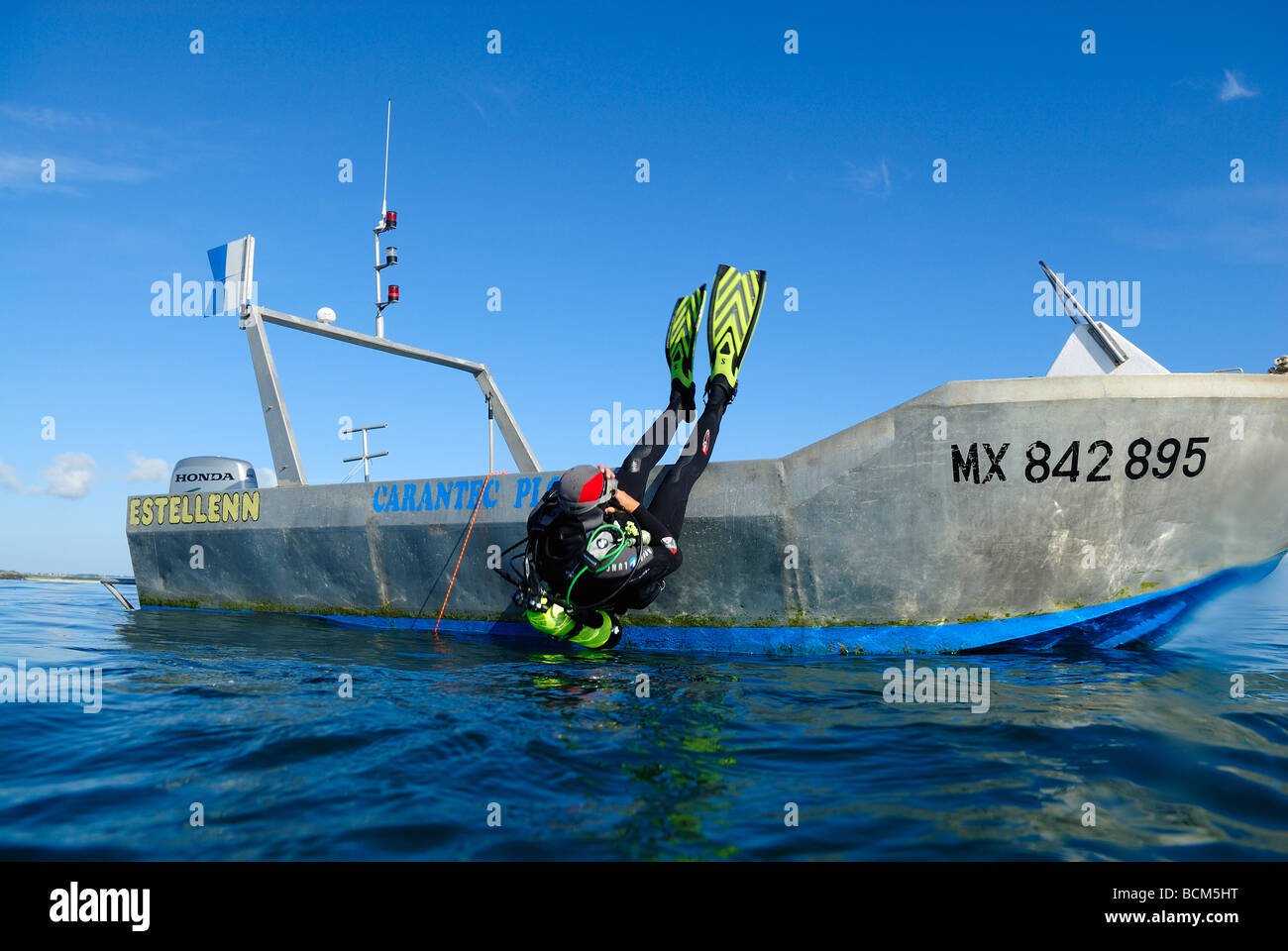 Scuba diver doing a back entry for a dive in North Brittany Stock Photo ...