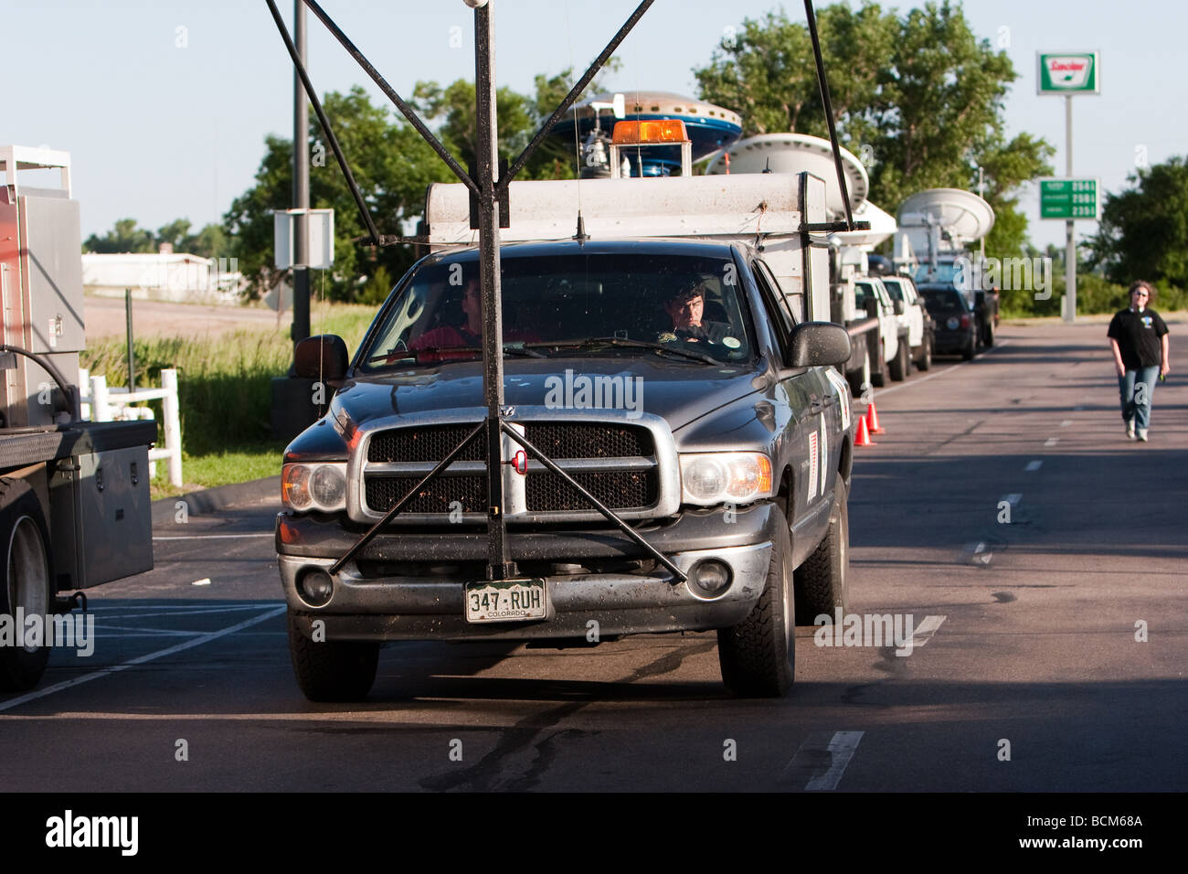 Tornado truck driving into storm hi-res stock photography and images ...