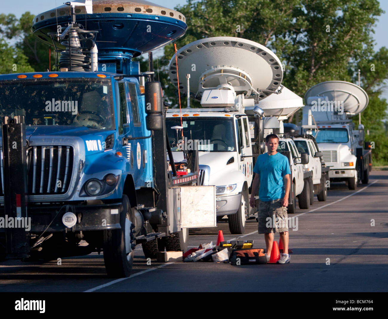 Mobile Doppler Radar trucks are lined up in a parking lot in Grand ...