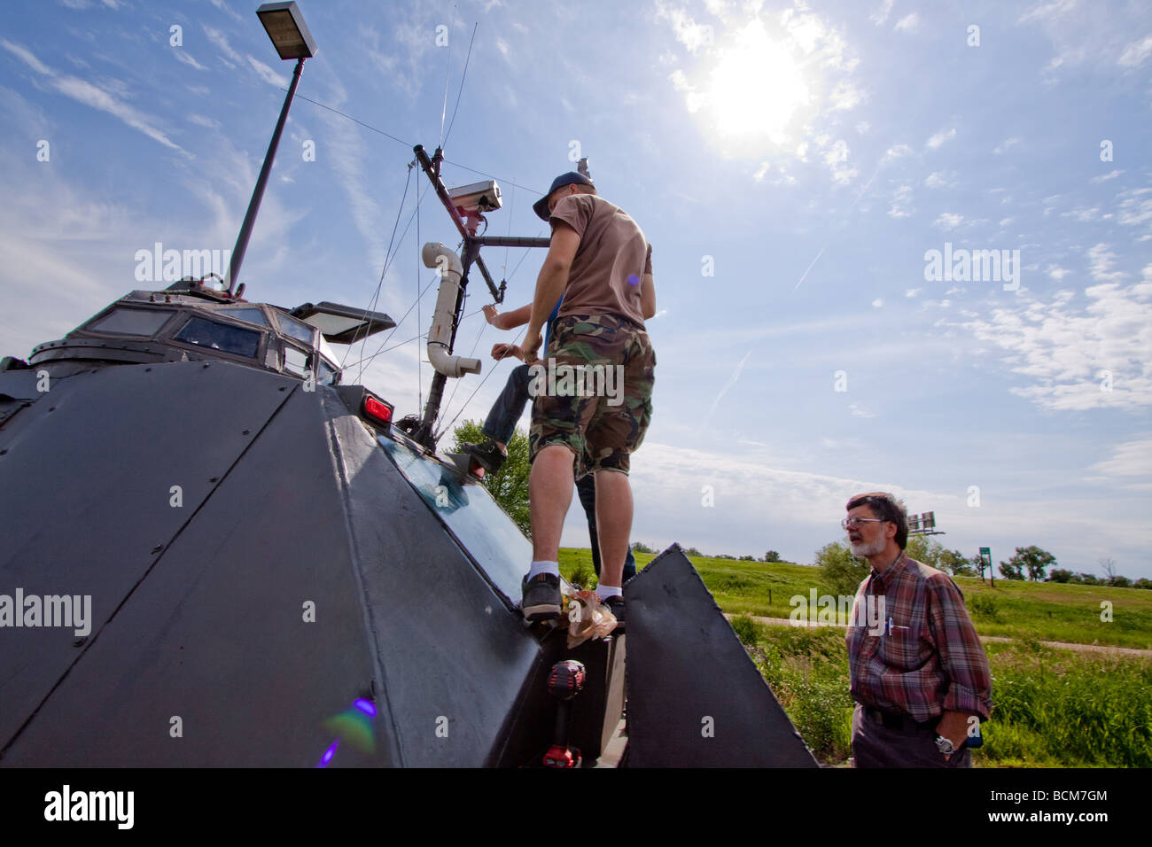Members of Project Vortex 2 attach weather instrumentation to the ...
