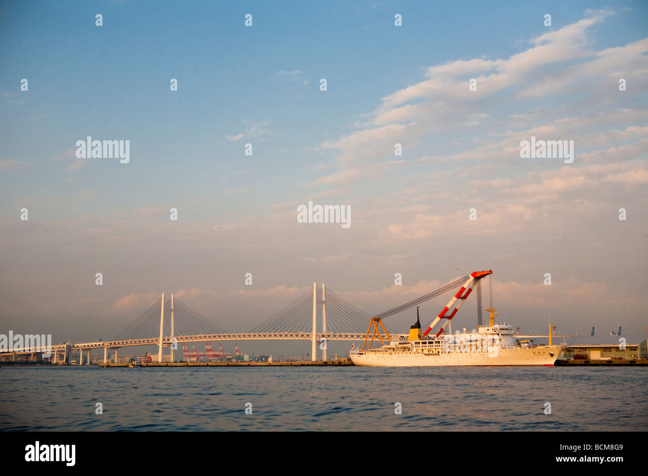 Japanese bridge and ship at sunset in yokohama harbor, japan Stock ...