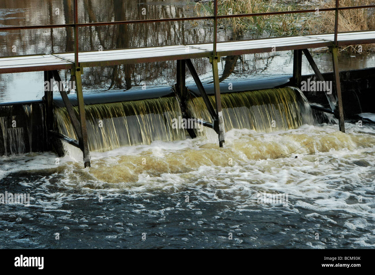 Little dam with water falling Stock Photo - Alamy