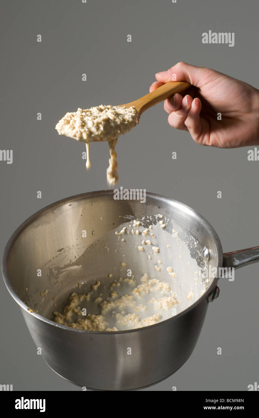 bland porridge dripping from spoon Stock Photo - Alamy