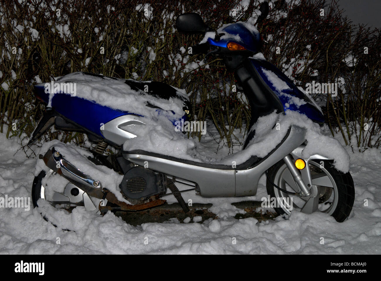 Covered moped hi-res stock photography and images - Alamy