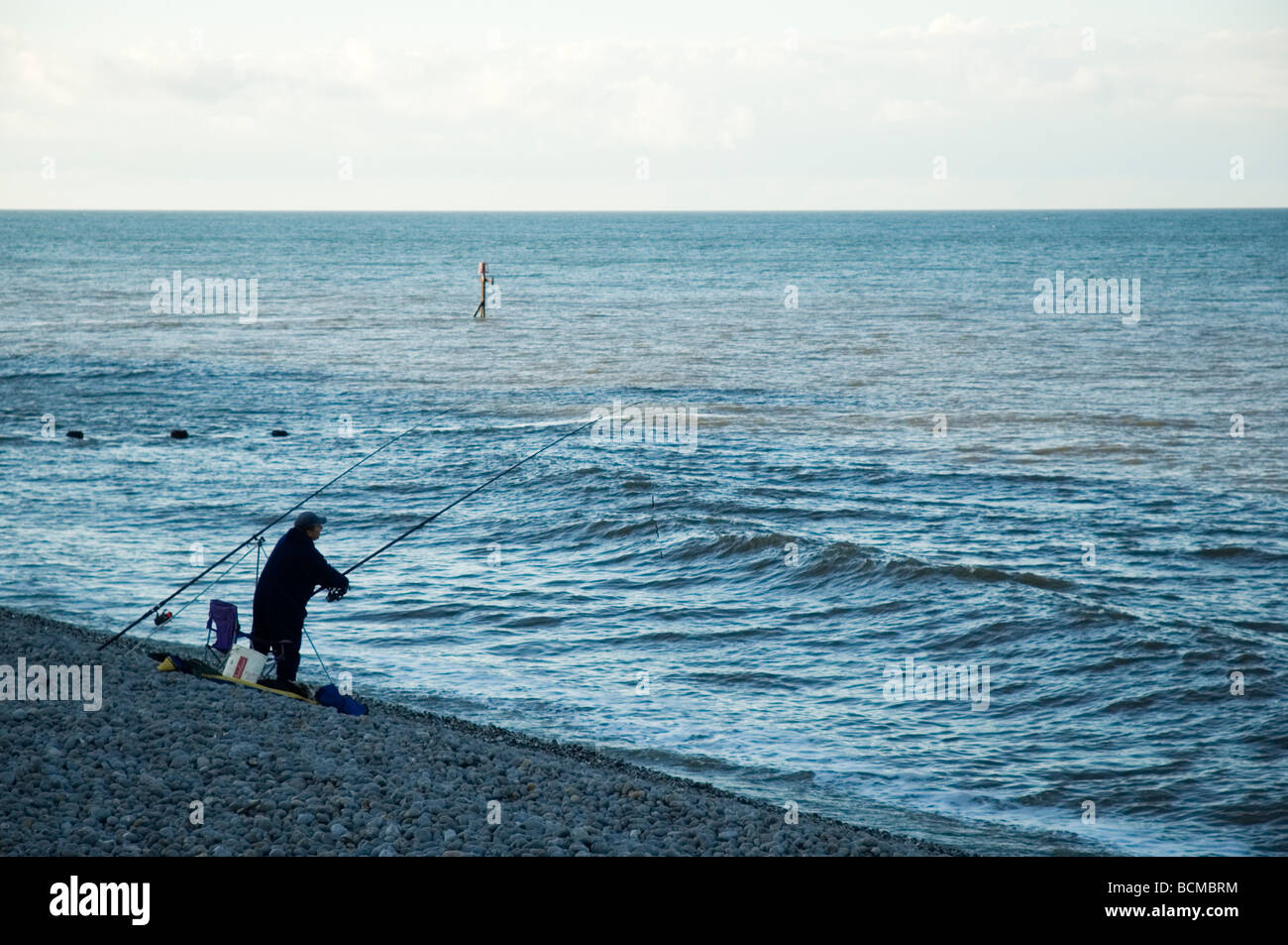 Sea angler on the beach at Sheringham, Norfolk, England Stock Photo - Alamy