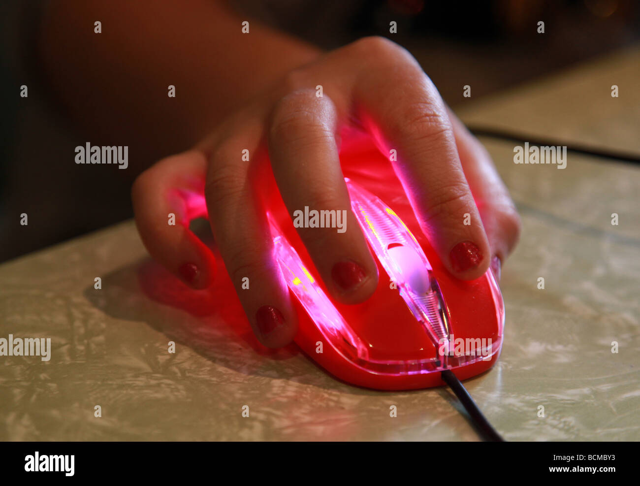 Female hand using a mouse Stock Photo - Alamy