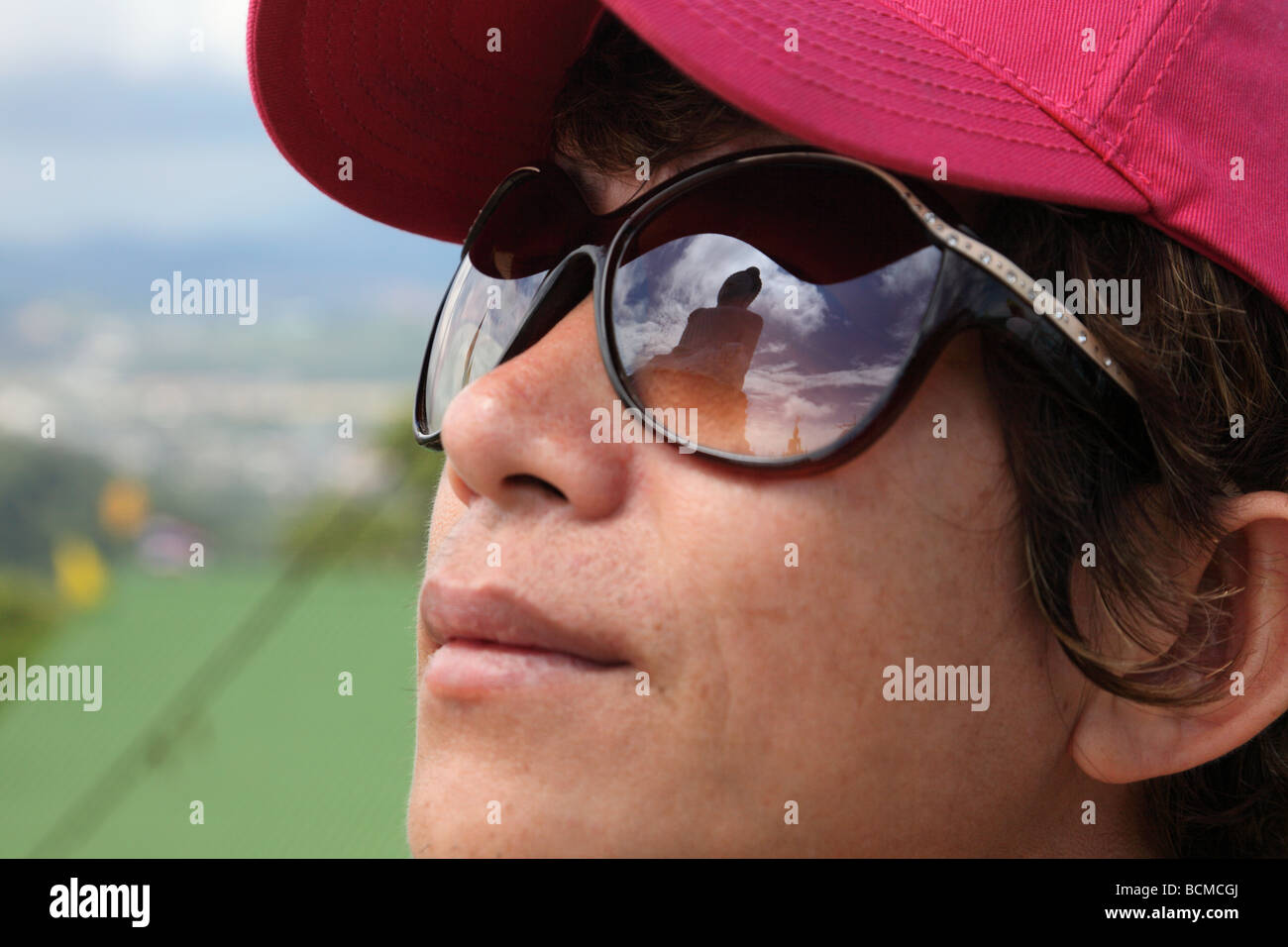 A Thai man looking at the 45 metre tall very big Budda on Phuket island ...