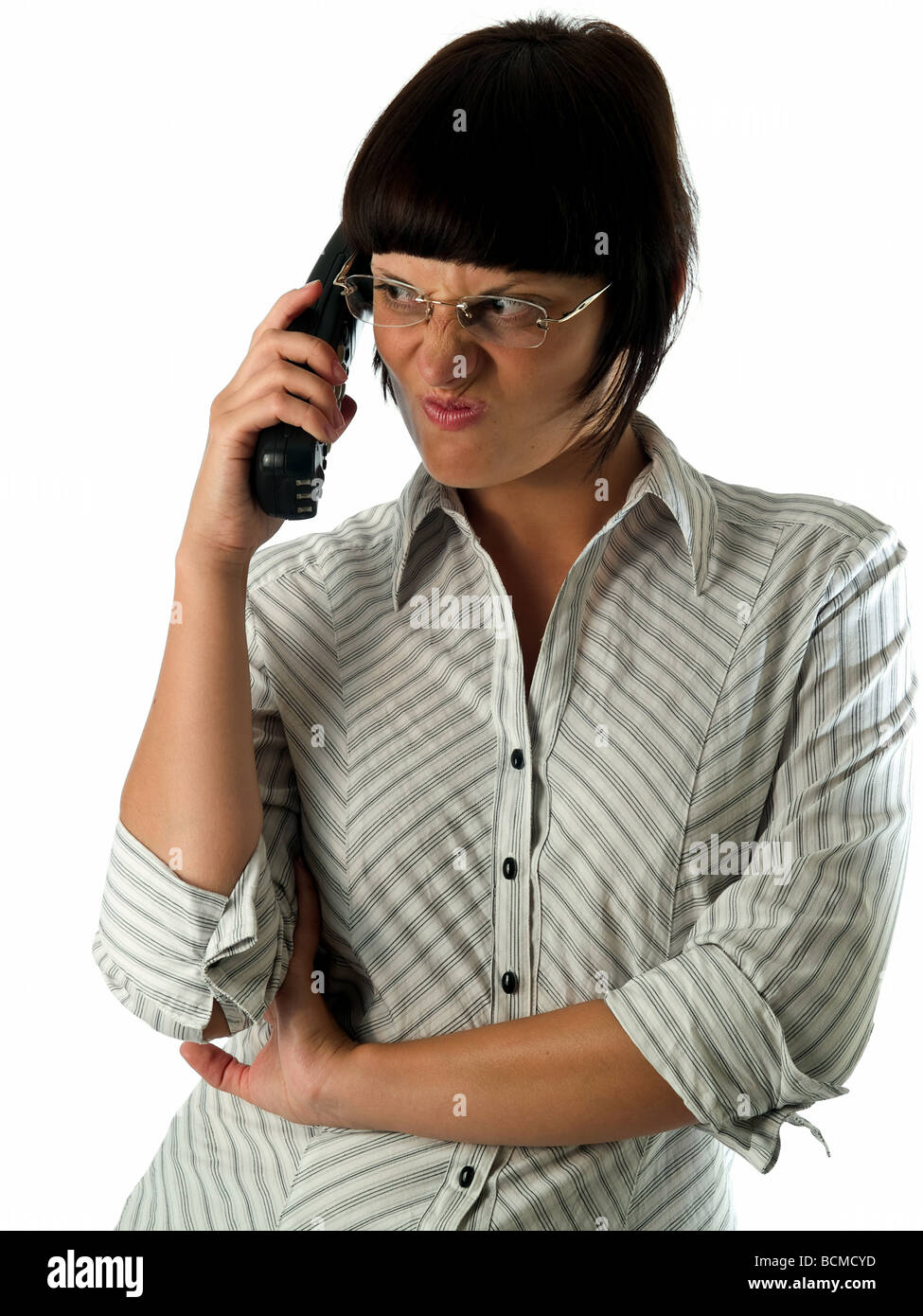 Young female secretary with angry face speaking phone Stock Photo - Alamy
