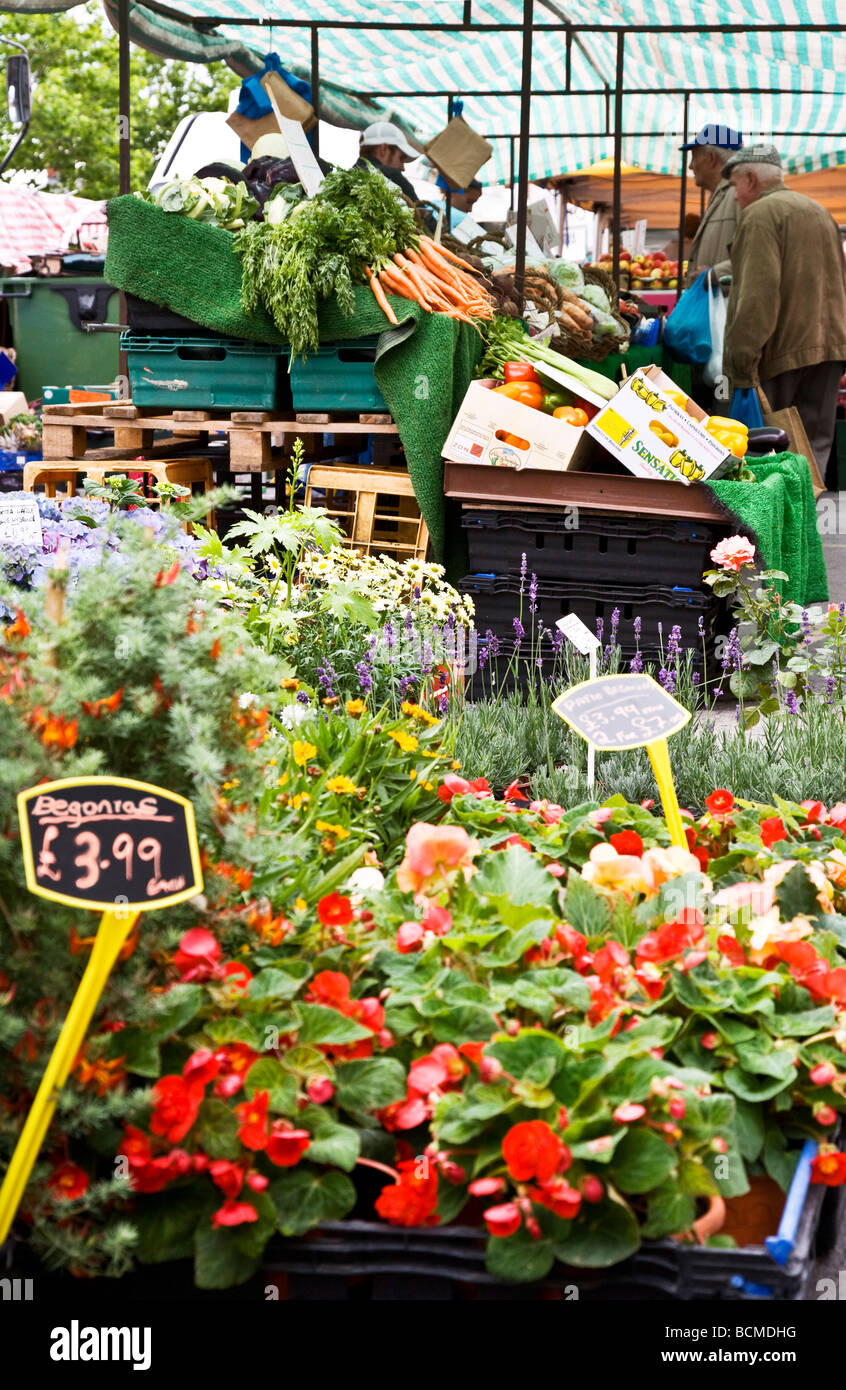 A flower and greengrocers stall at the Thursday farmer's market in the ...
