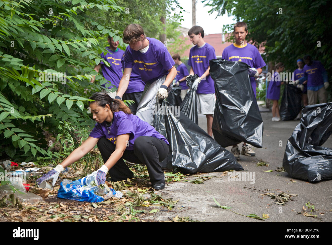 High School Volunteers Clean Trash from Alley Stock Photo - Alamy