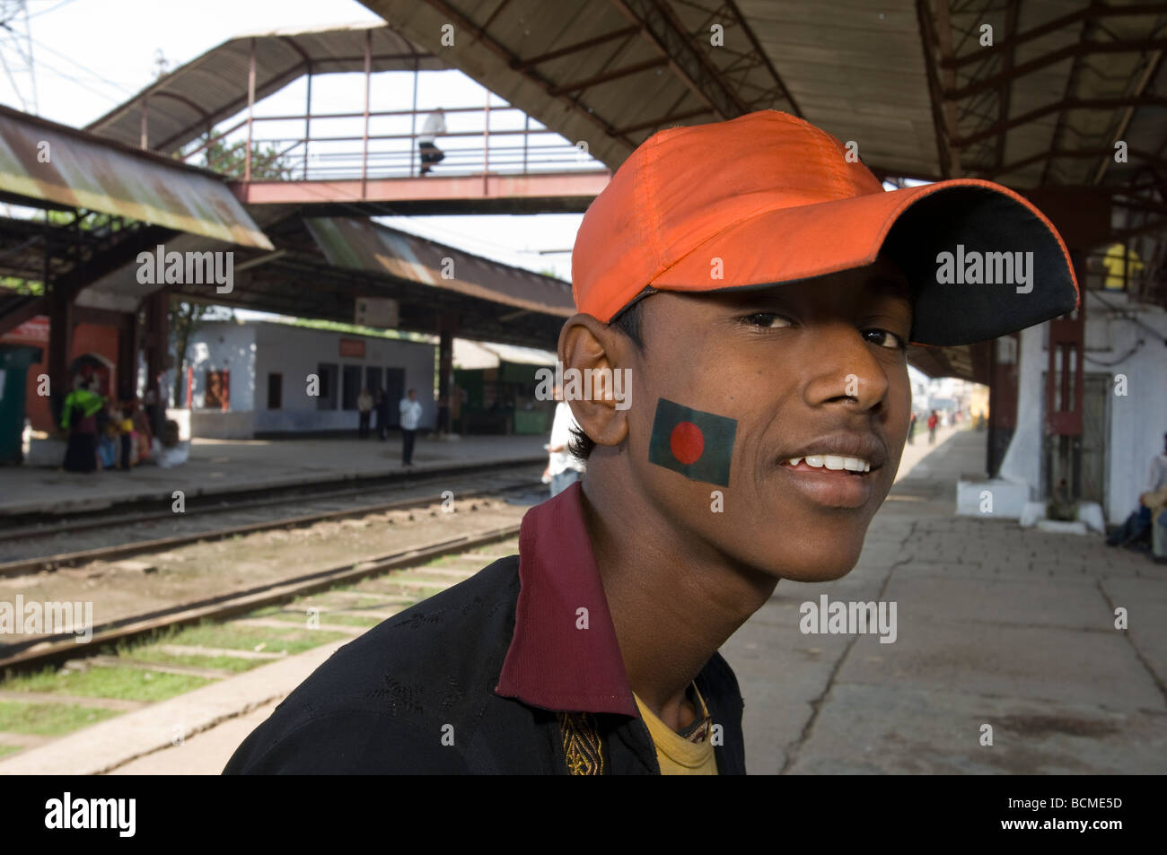 Boy in orange baseball cap with bangladesh map on cheek khulna railway ...