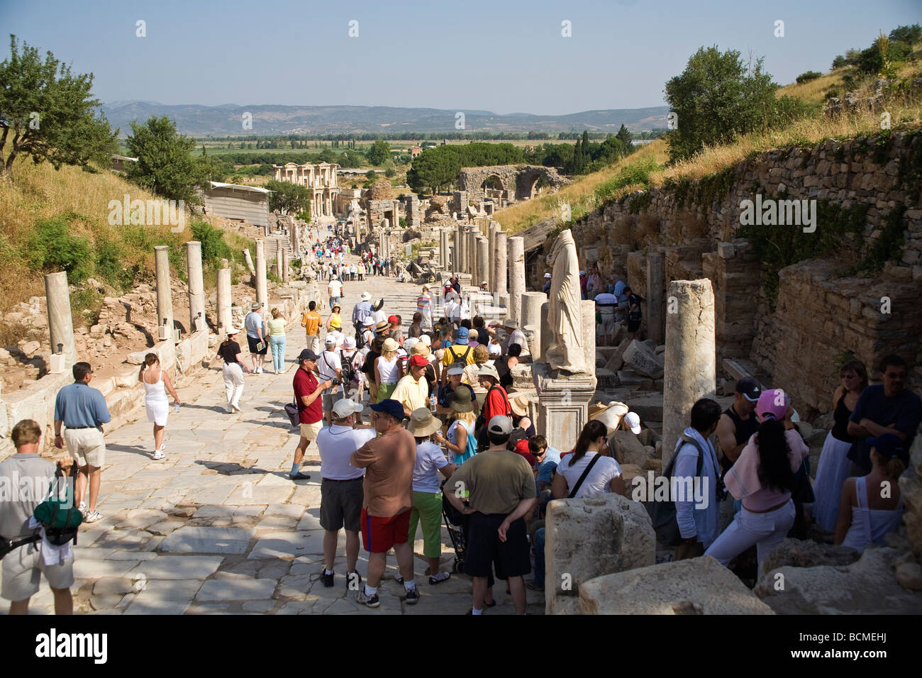Visitors walking along the Marble Road in ancient Ephesus Stock Photo ...