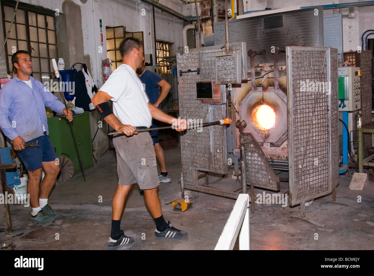 Italy Veneto Murano Glass blower putsglass in the furnace Stock Photo ...