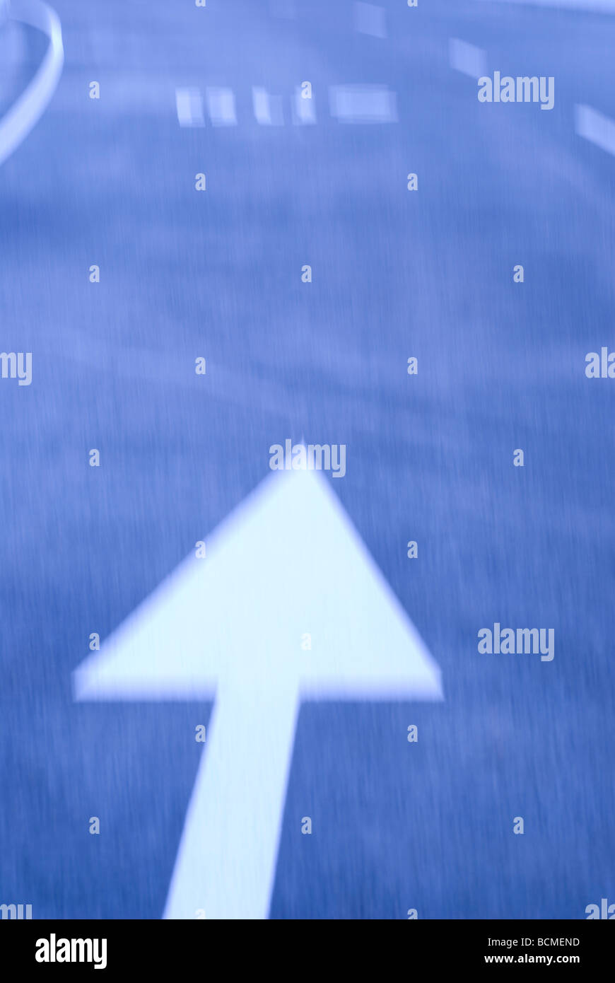 Arrow and bus sign on the road in motion Stock Photo - Alamy