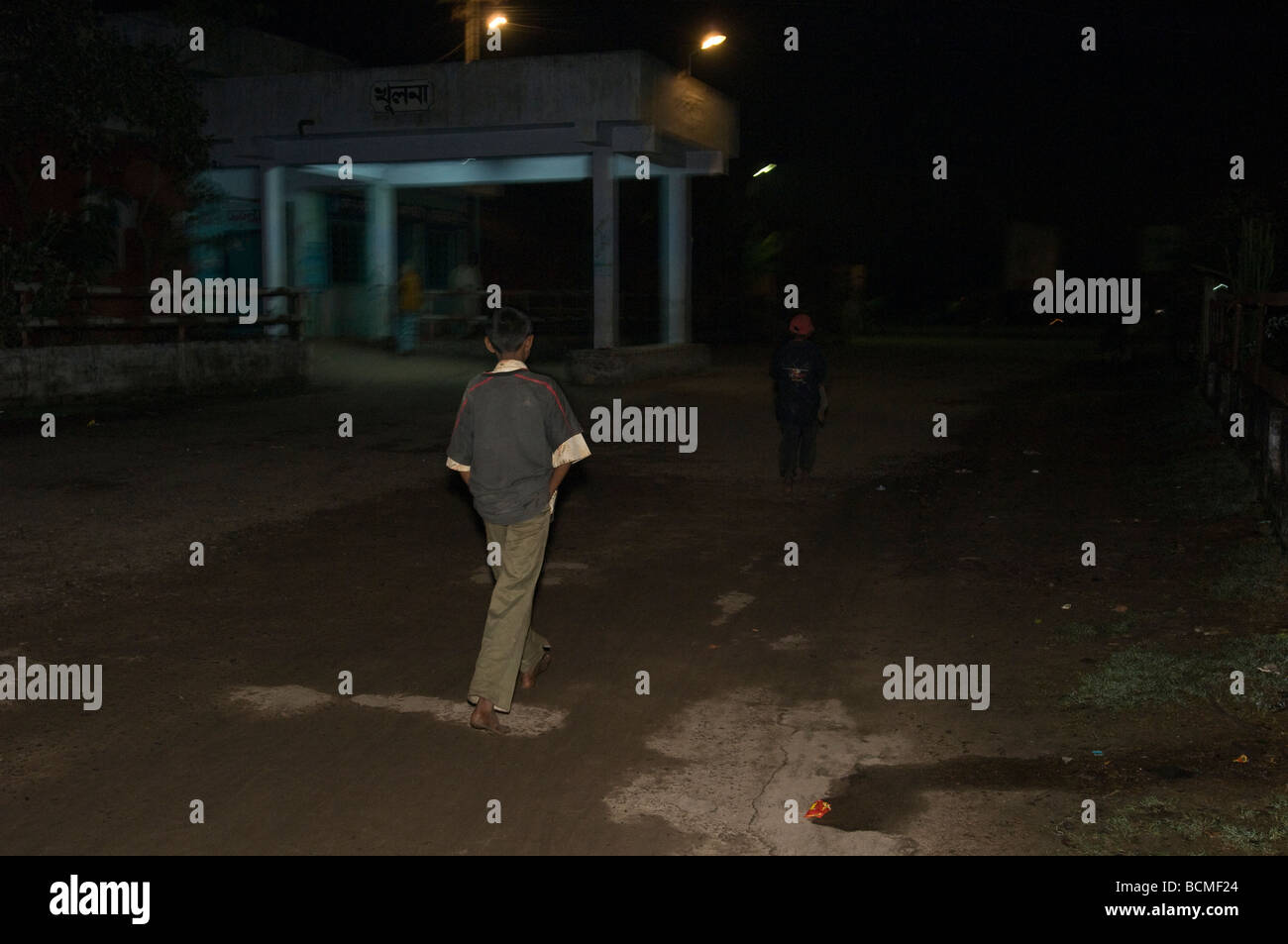 Back of young boy at night at Khulna railway station Bangladesh Stock ...