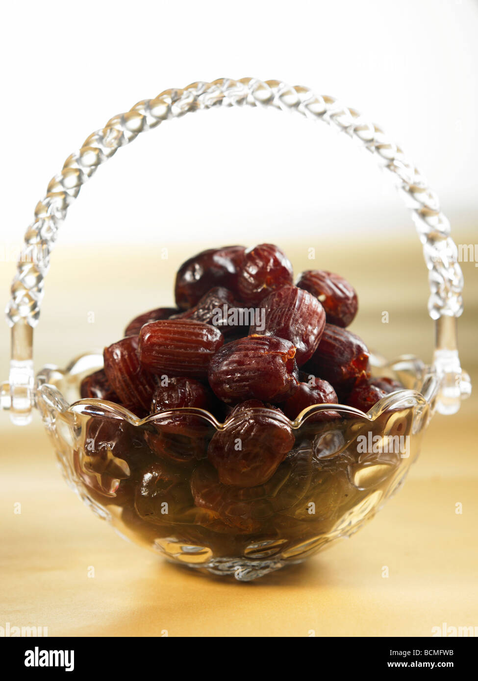 dates in a glass basket Stock Photo - Alamy