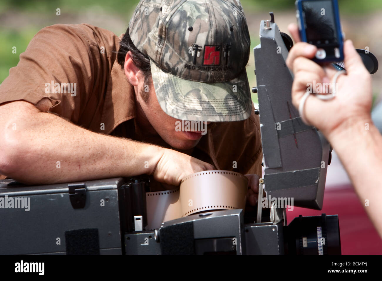 Sean Casey s IMAX team loads film into an IMAX camera during Project ...