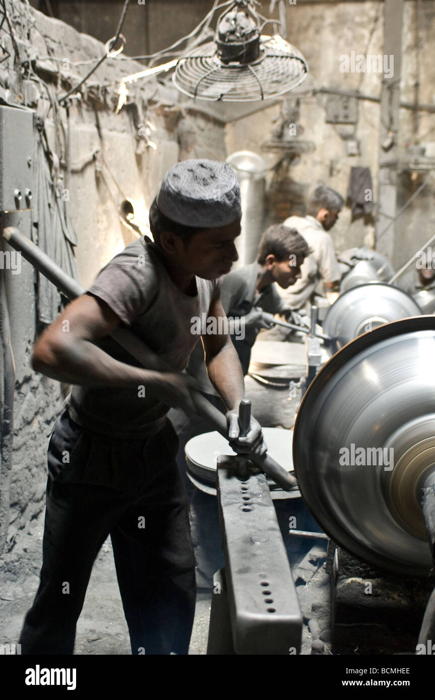 Dhaka child labour Metal turning factory Stock Photo - Alamy