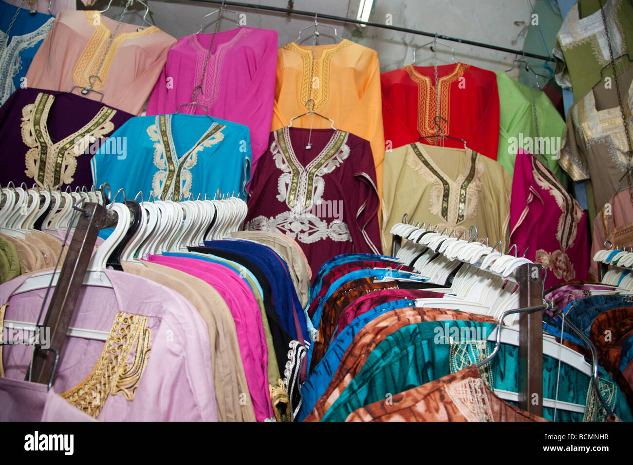 A shop in the Tunis Medina (old city) displays racks of tunics and ...